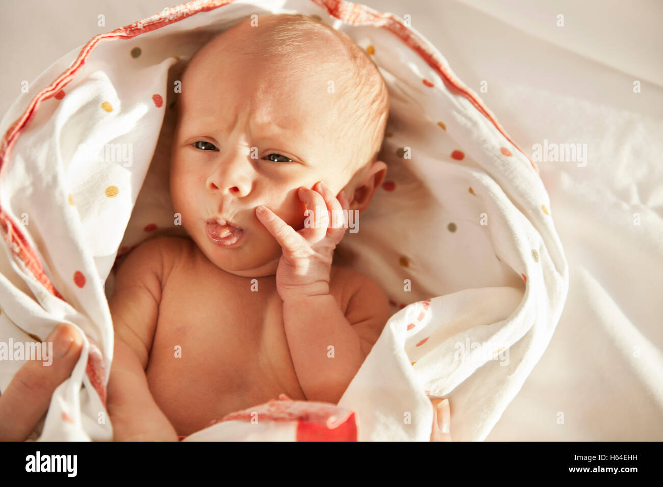 Newborn making a funny face Stock Photo - Alamy