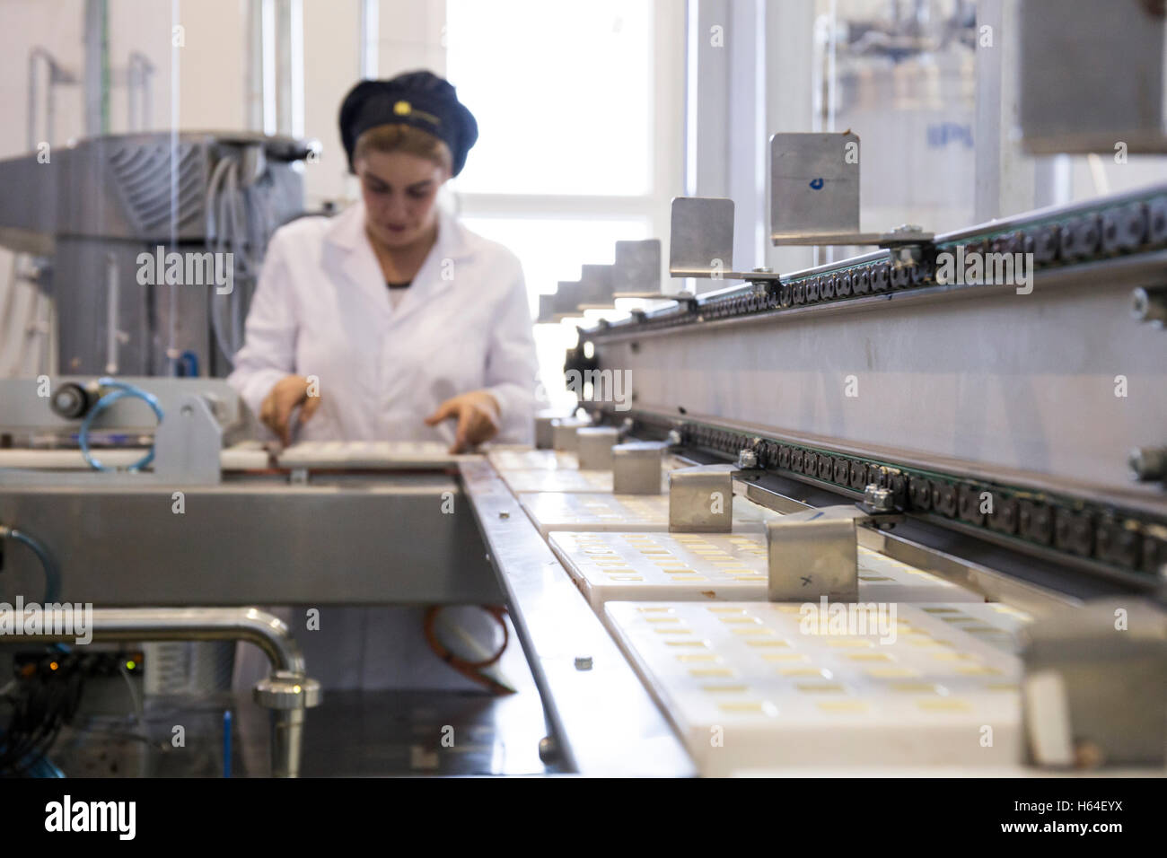 Woman working in a chocolate factory Stock Photo - Alamy