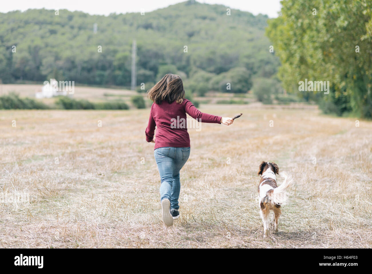Women Running After Their Dog