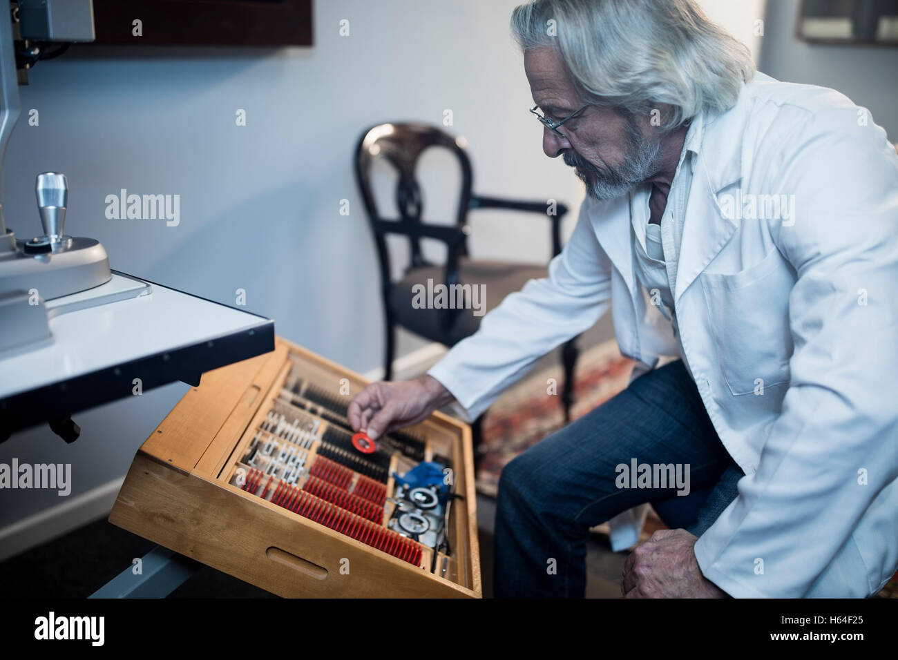 Optometrist choosing eye test lenses hi-res stock photography and ...