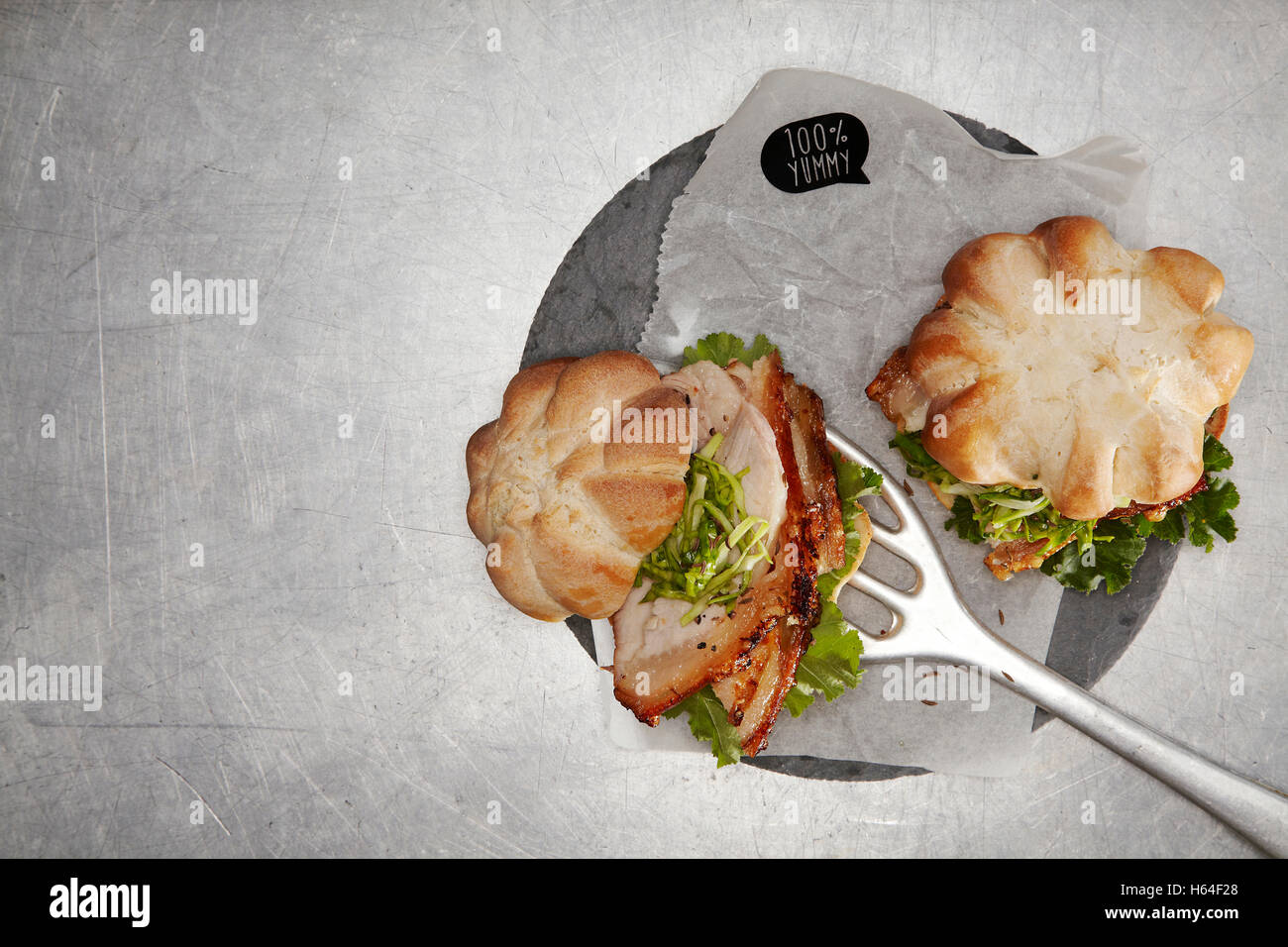 German style burger with pork roast, sweetheart cabbage and mustard ...