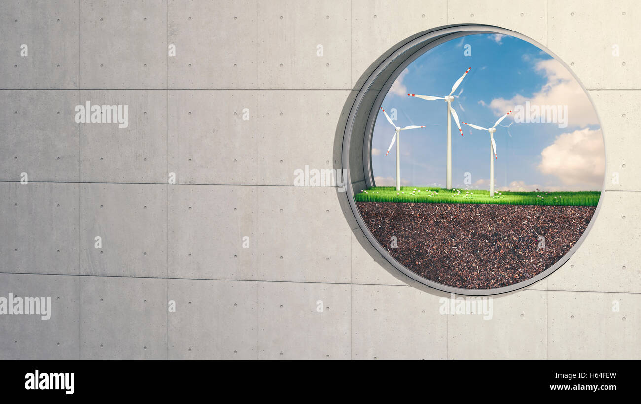 Porthole in concrete wall with wind turbines in nature Stock Photo - Alamy