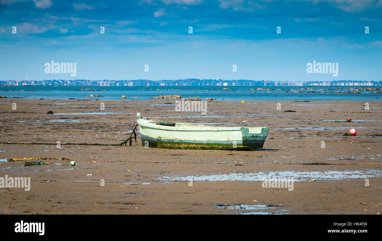 small fishing boat stranded on the sand Stock Photo - Alamy