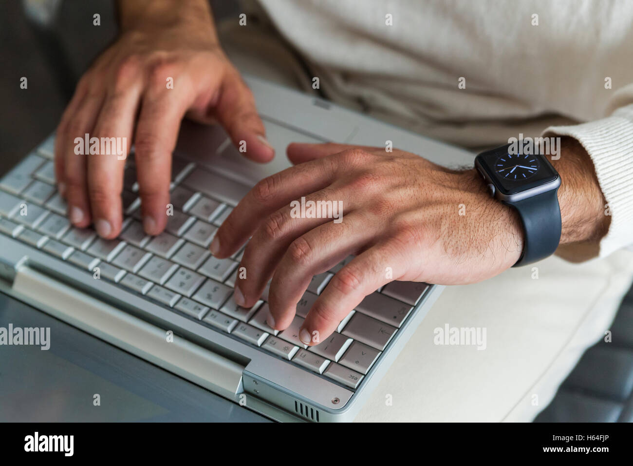 Man's hands using laptop, close-up Stock Photo - Alamy