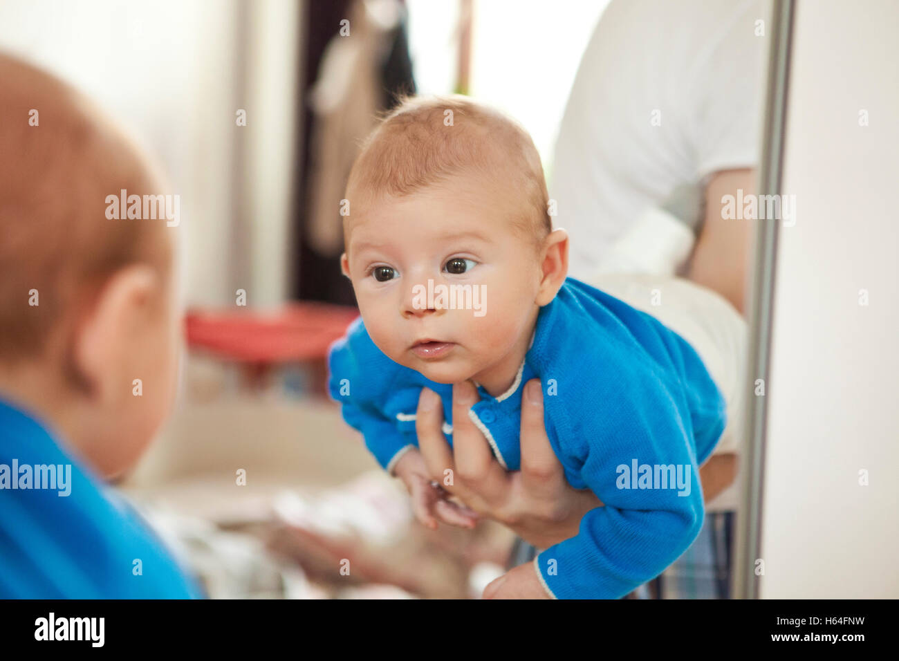 Father holding baby mirror hi-res stock photography and images - Alamy