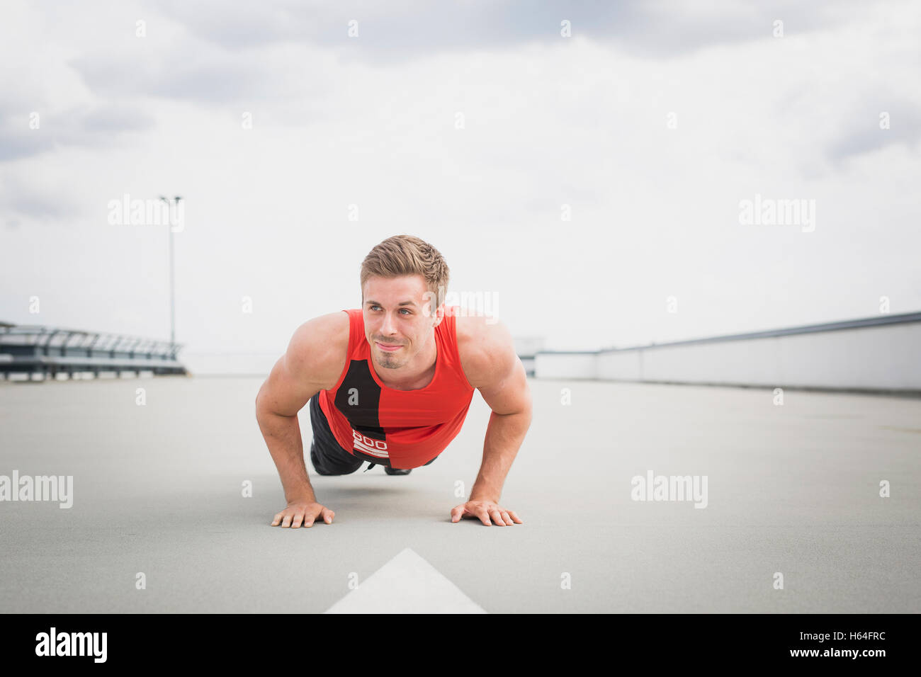 Man doing push ups outdoor Stock Photo - Alamy