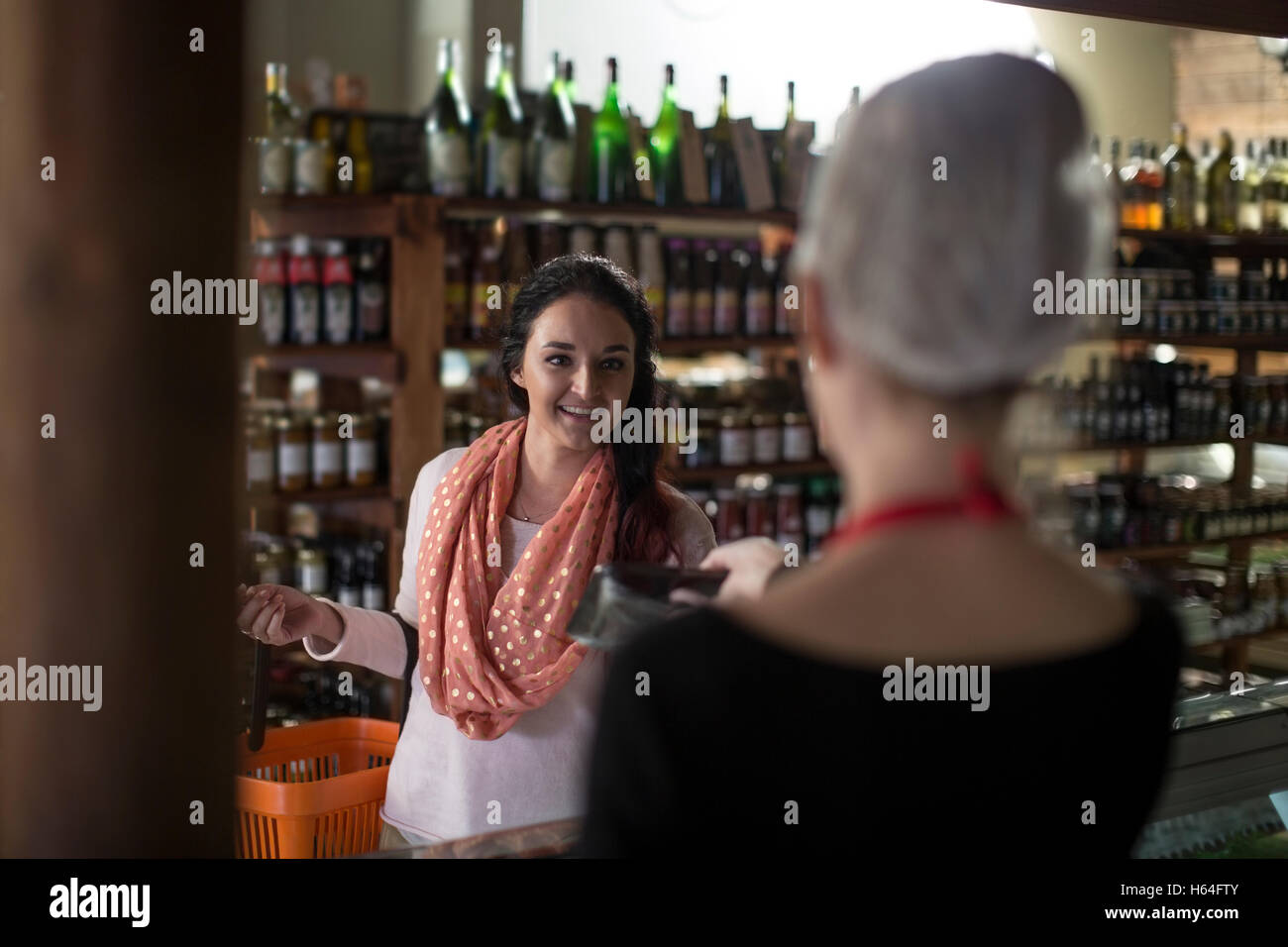 Women talking to shop assistant hi-res stock photography and images - Alamy