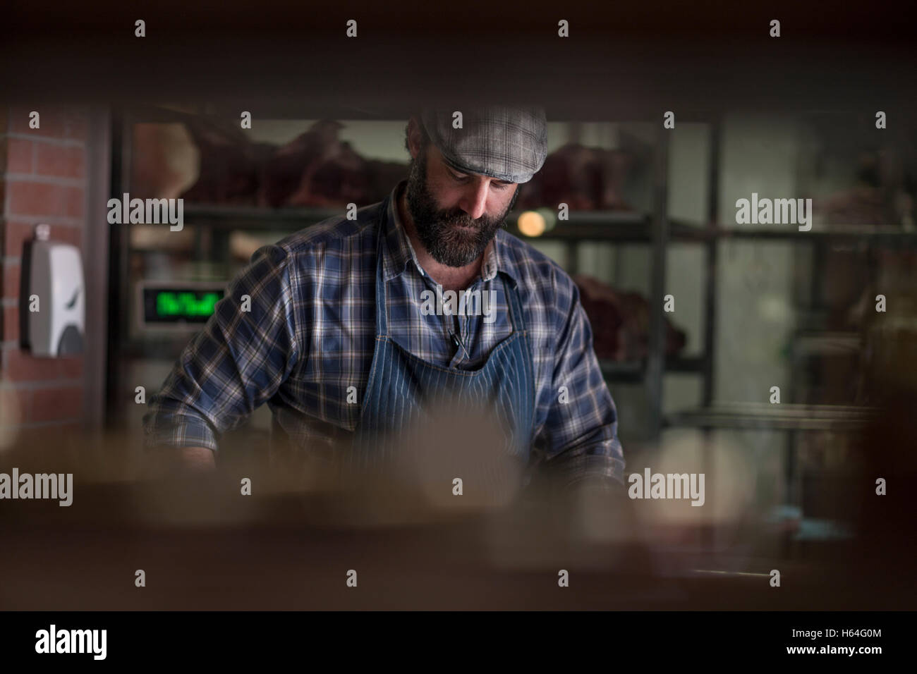 Butcher in butchery Stock Photo - Alamy
