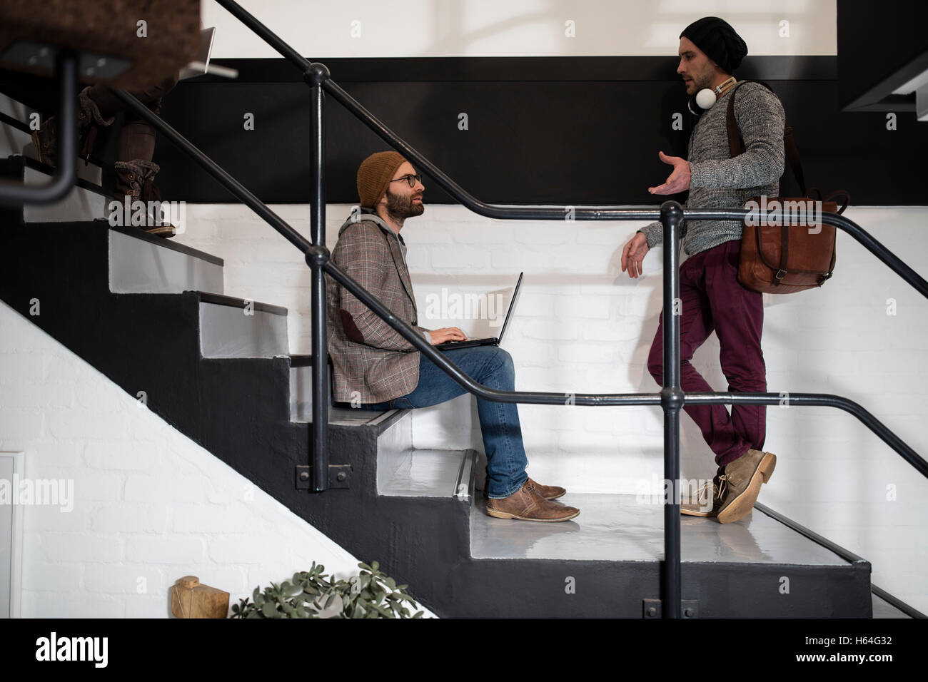 Two Men Sitting On Stairs Talking High Resolution Stock Photography and ...