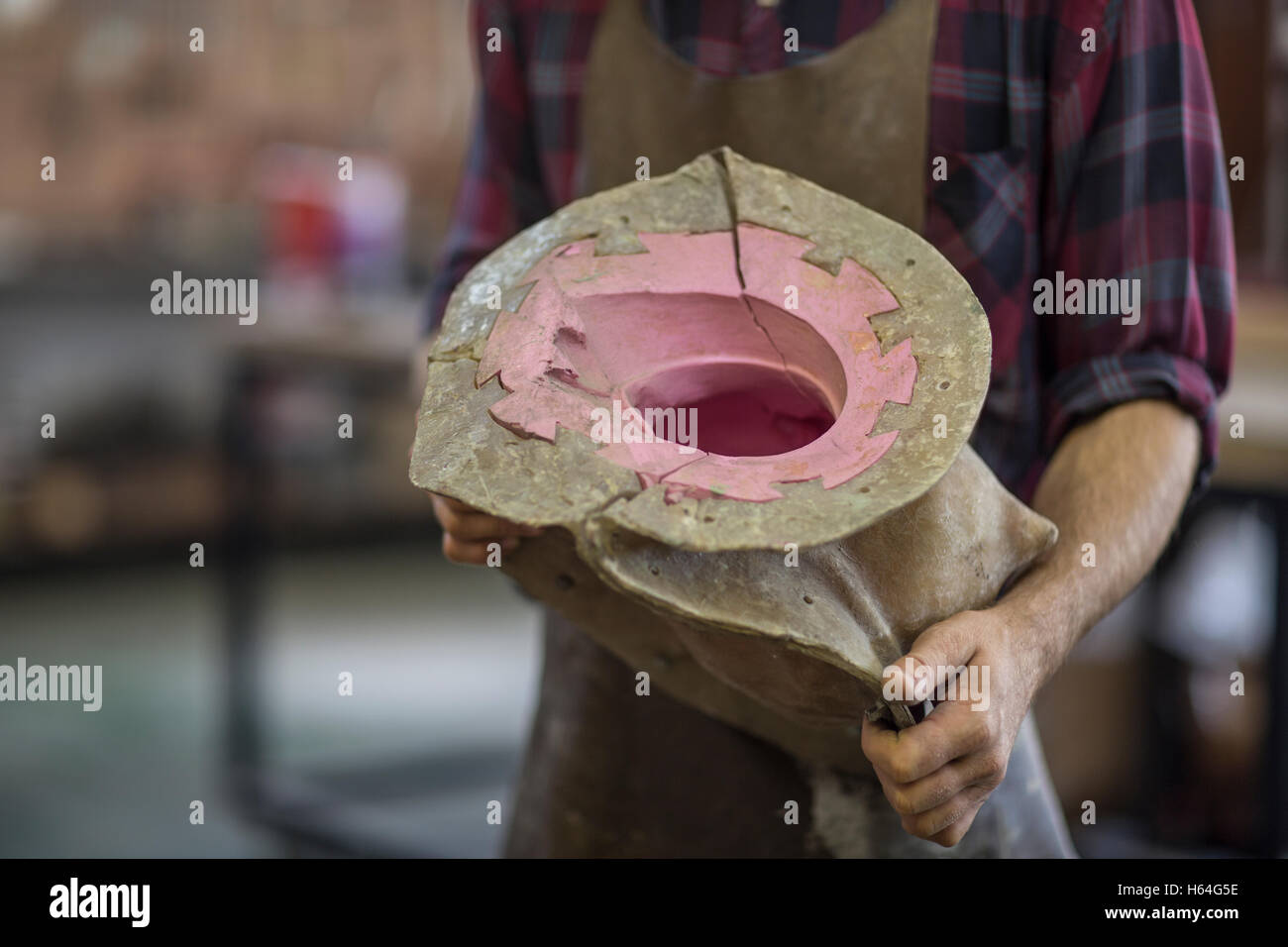 Sculptor holding mould in studio Stock Photo - Alamy