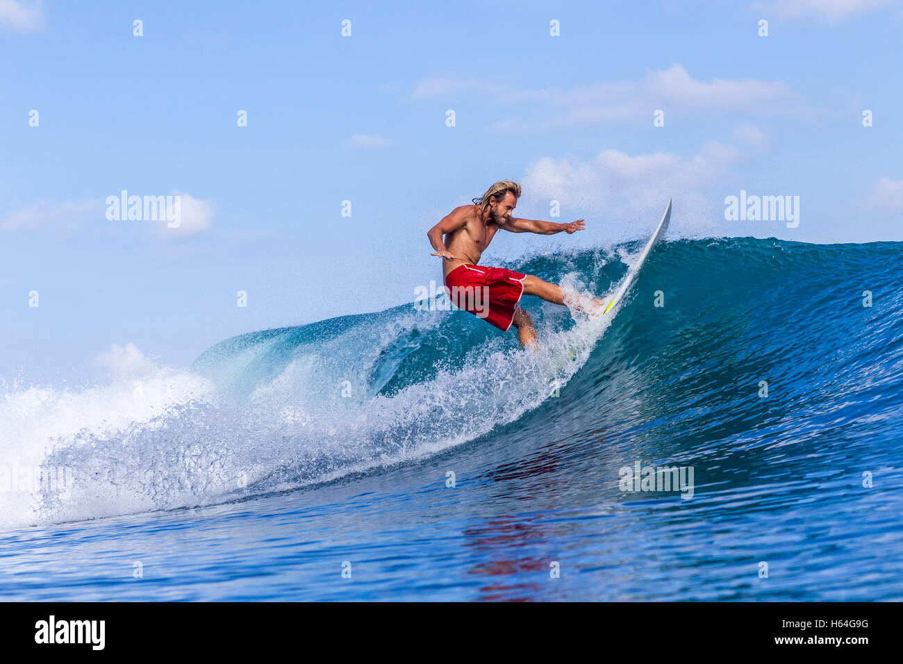 Surfer on a wave Stock Photo - Alamy