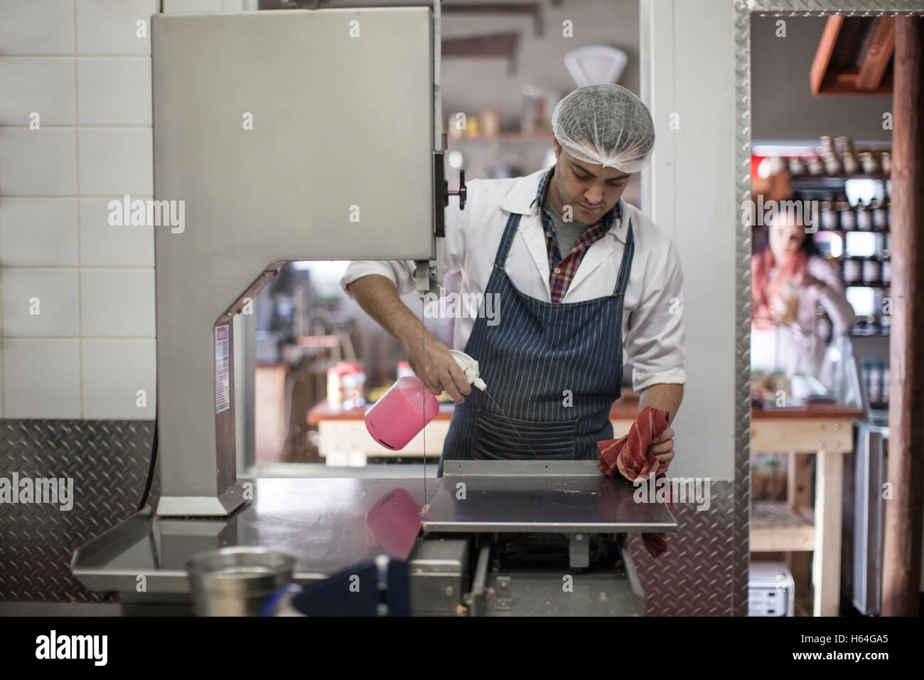 Butcher cleaning work surface in butchery Stock Photo - Alamy