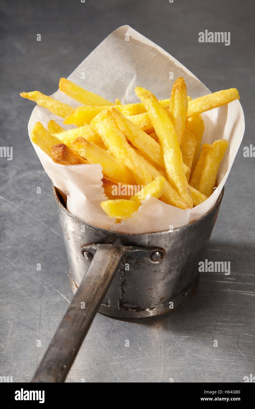 French fries in metal pan Stock Photo - Alamy