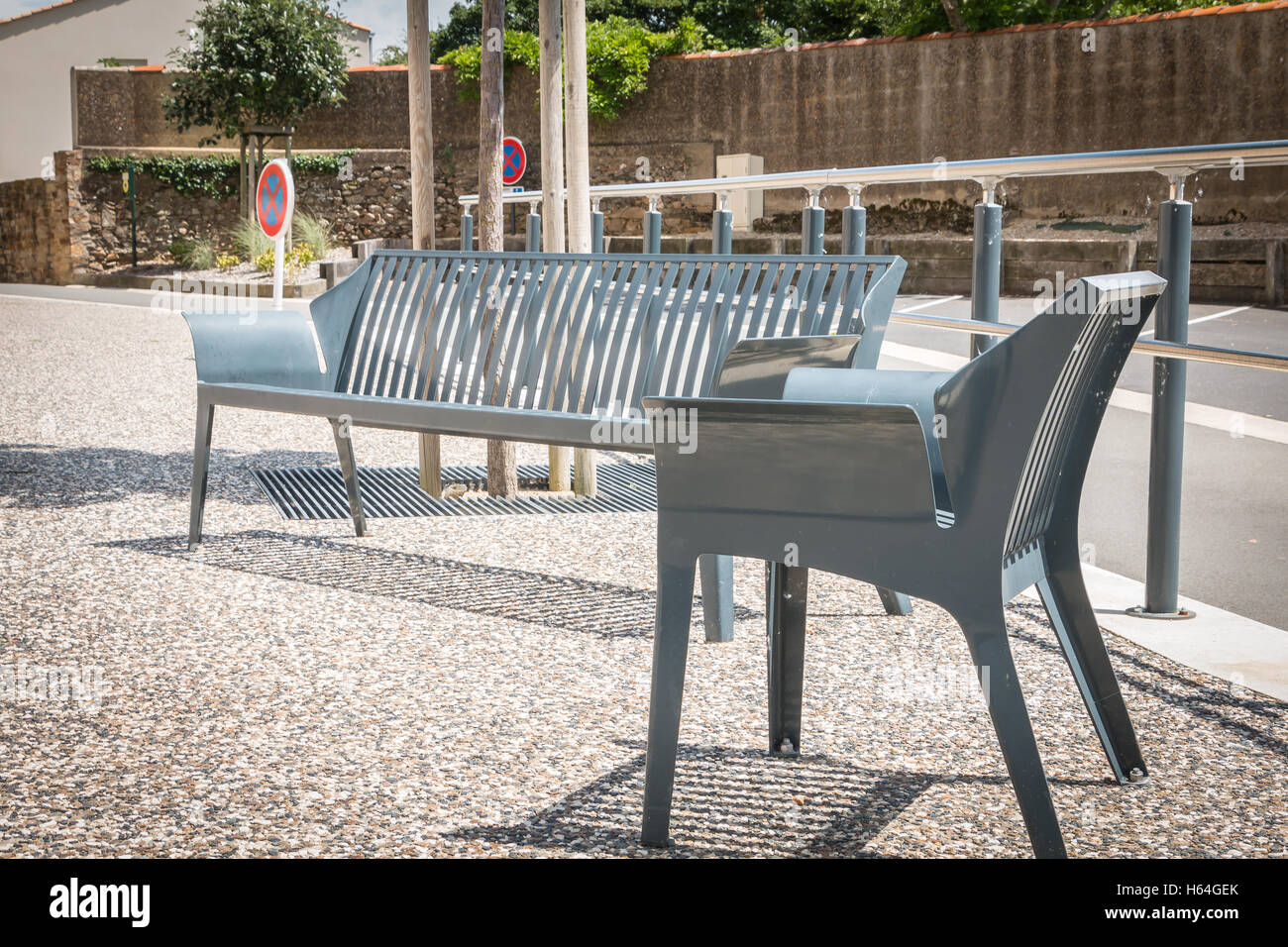 modern public metal bench in the street Stock Photo - Alamy