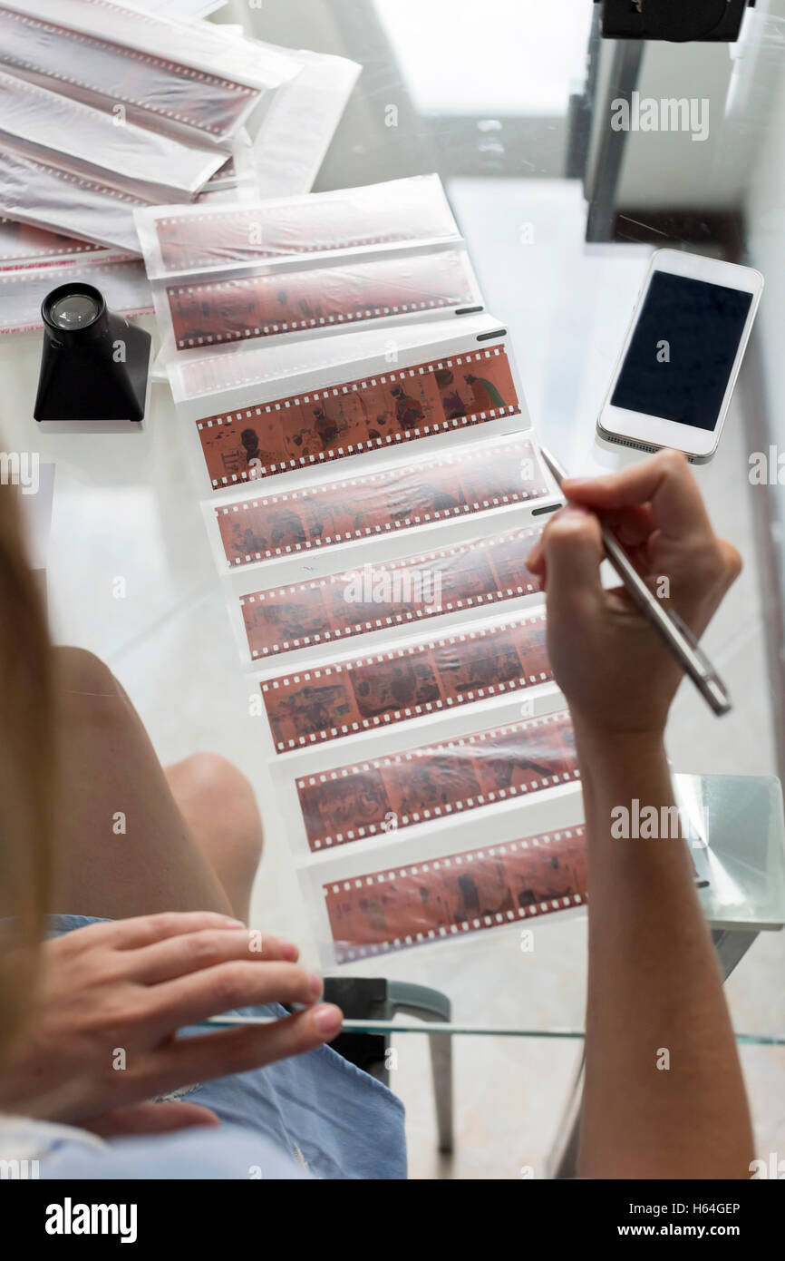 Woman labeling film strips Stock Photo - Alamy