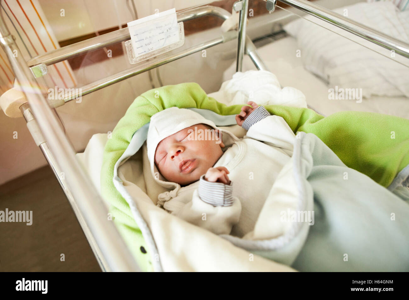 Newborn baby in hospital bed Stock Photo - Alamy