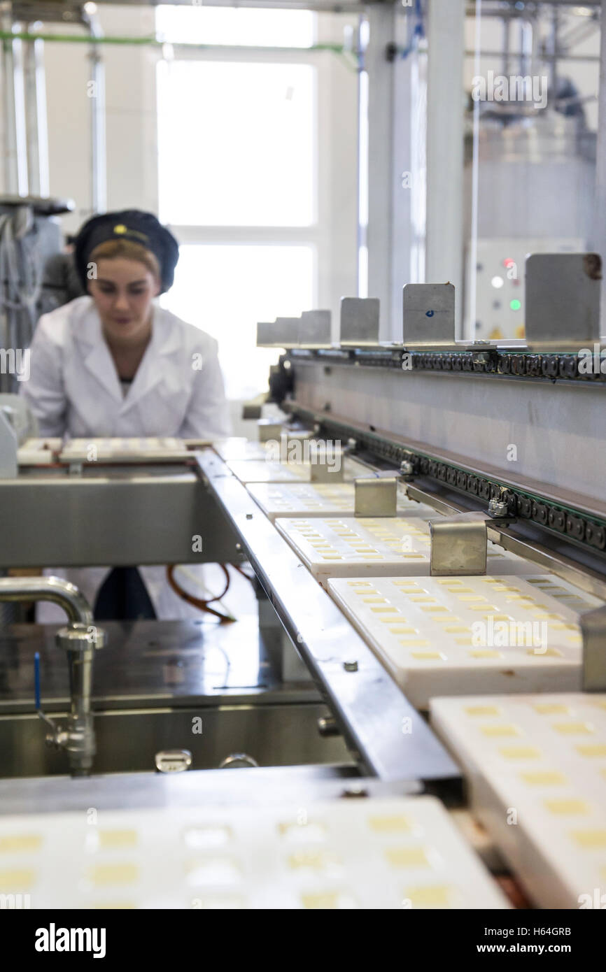 Woman working in a chocolate factory Stock Photo - Alamy