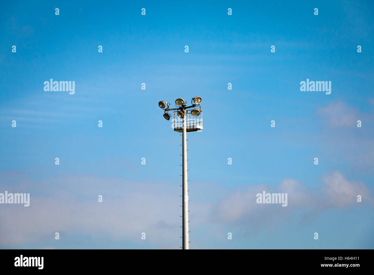 stadium light projector on blue sky Stock Photo - Alamy