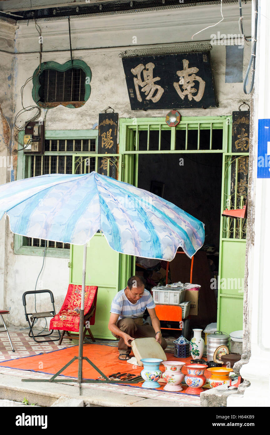 Laying out items for sale on private house veranda, Lorong Stewart ...