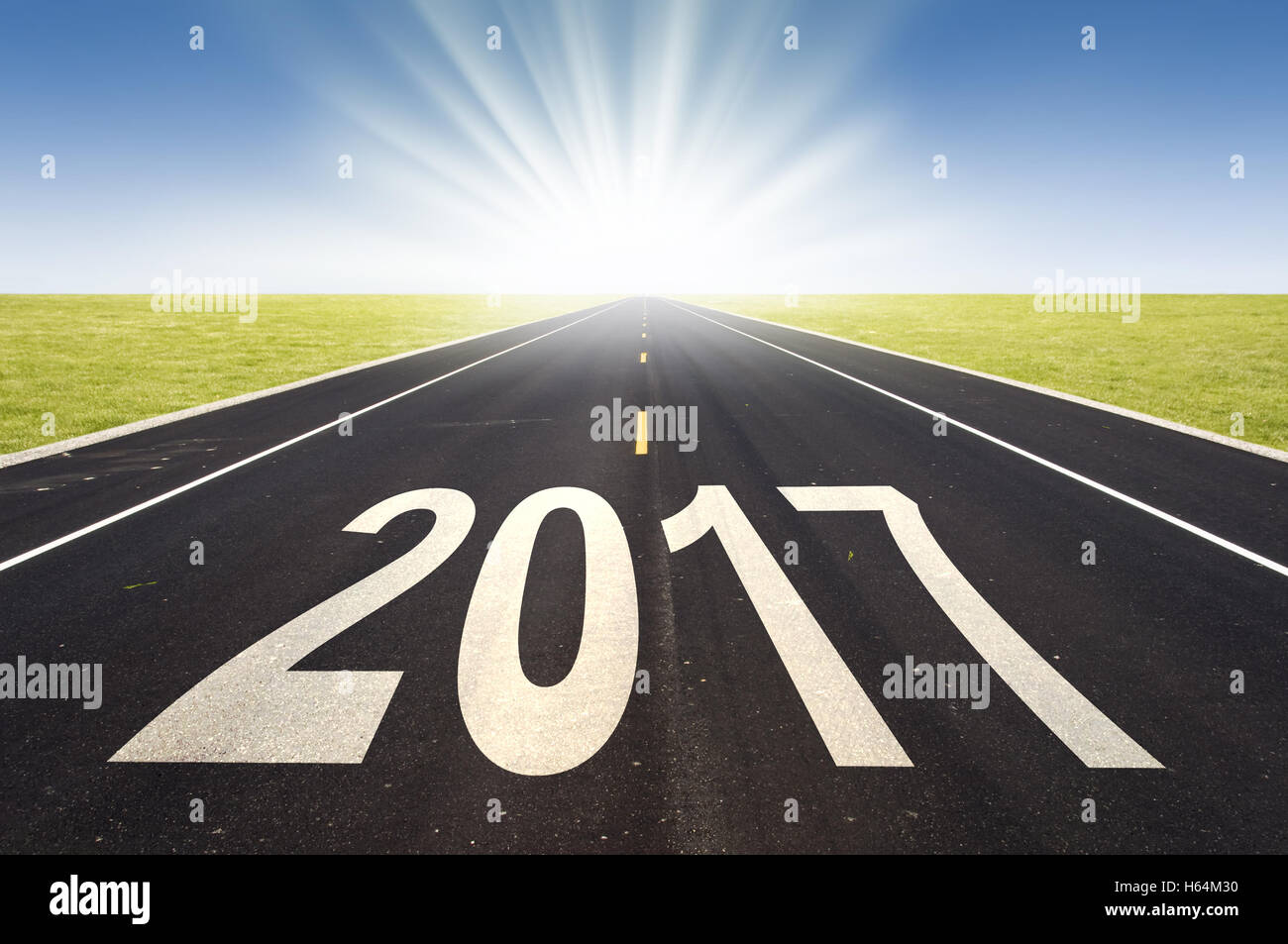 2017 road perspective with rising sun Stock Photo - Alamy