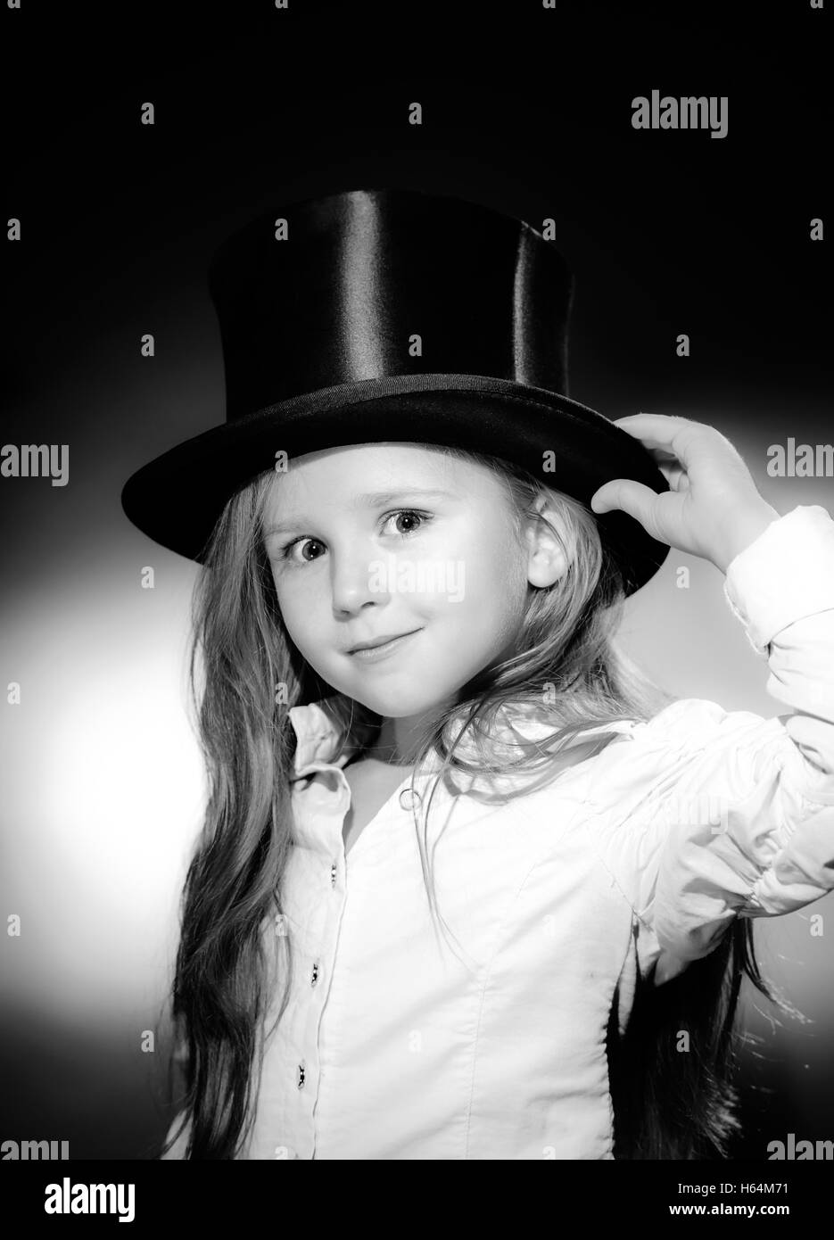 Cute little girl posing in gibus, old-style opera hat, vintage photo ...