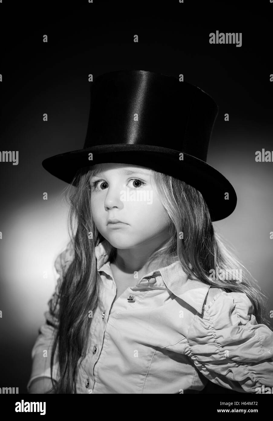 Cute little girl posing in gibus, old-style opera hat, vintage photo ...