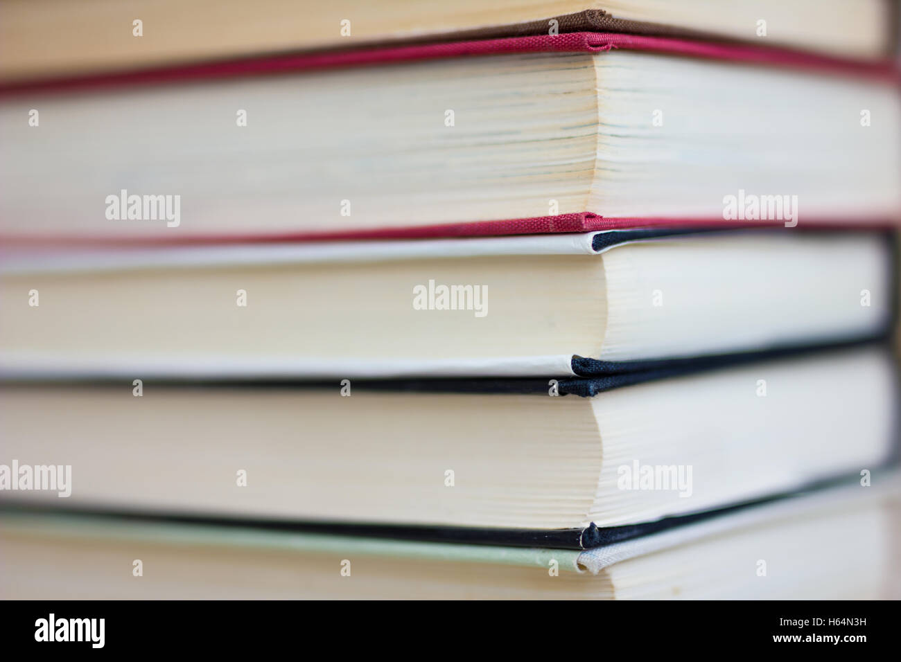 Closeup of stacked old books and textbook Stock Photo - Alamy