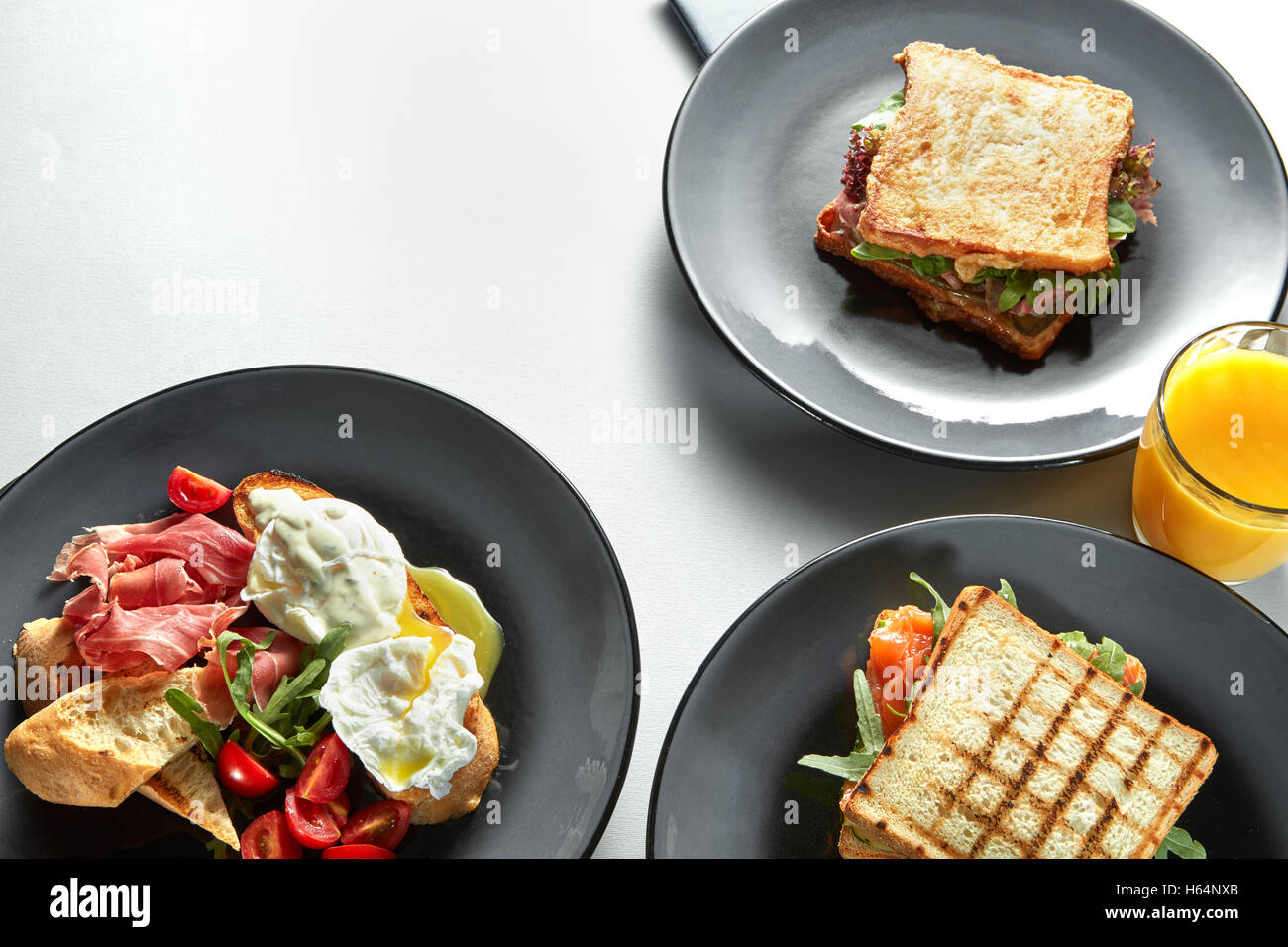 Traditional Hotel Breakfast served at table with ham and tomato, toasts ...