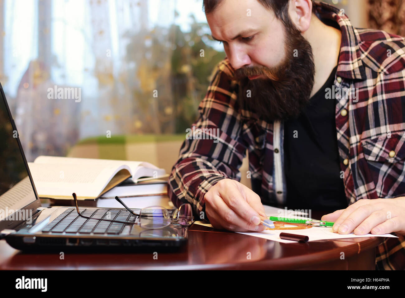 male notebook work bearded Stock Photo - Alamy