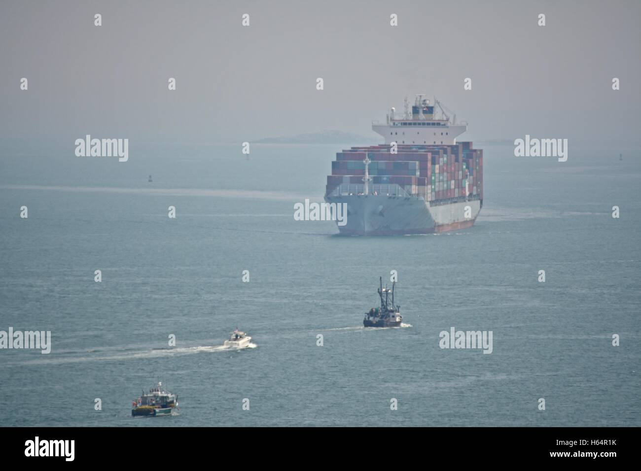 A cargo ship sailing into the Boston Seaport Cargo Terminal in South ...