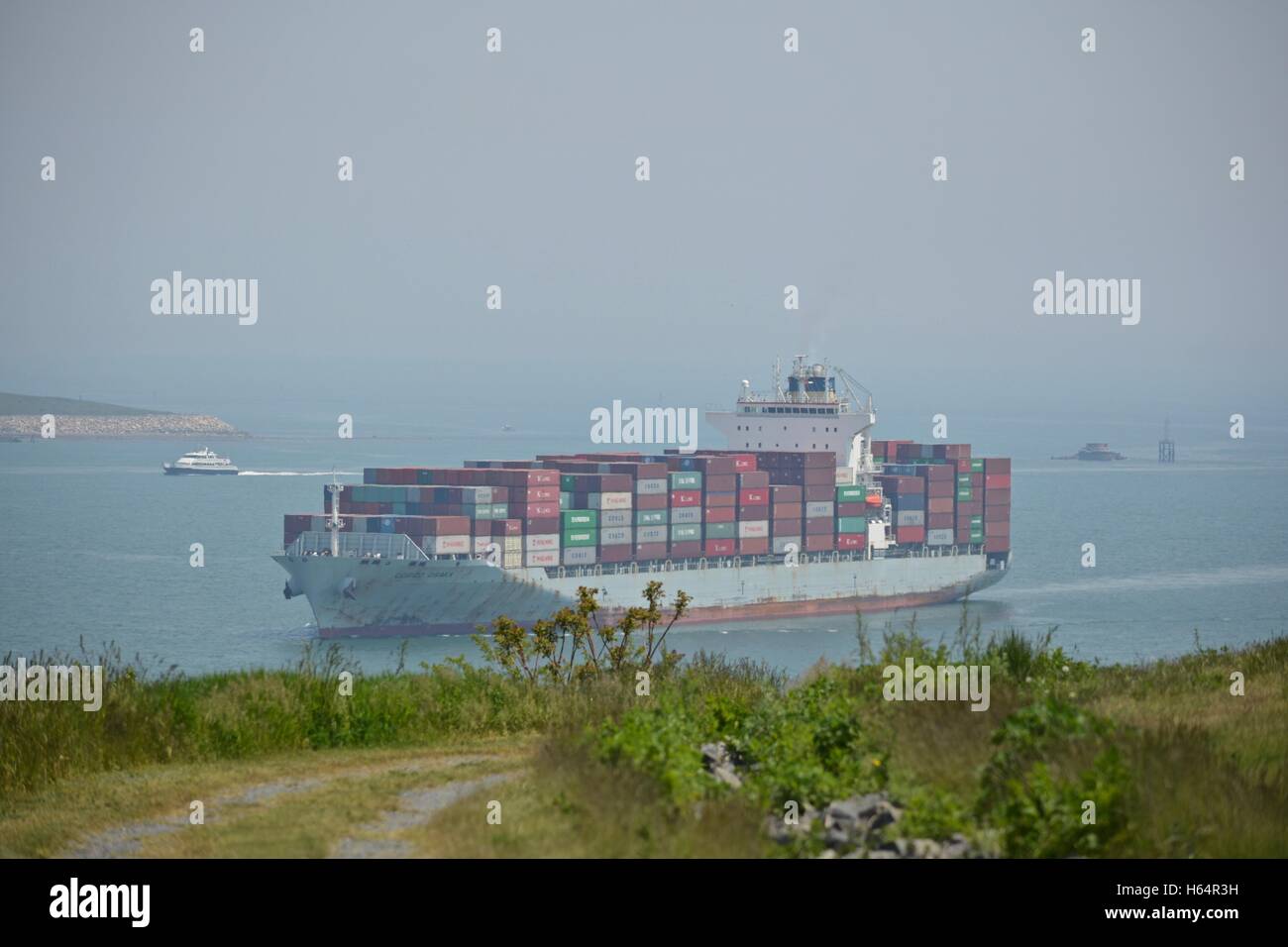 A cargo ship sailing into the Boston Seaport Cargo Terminal in South ...