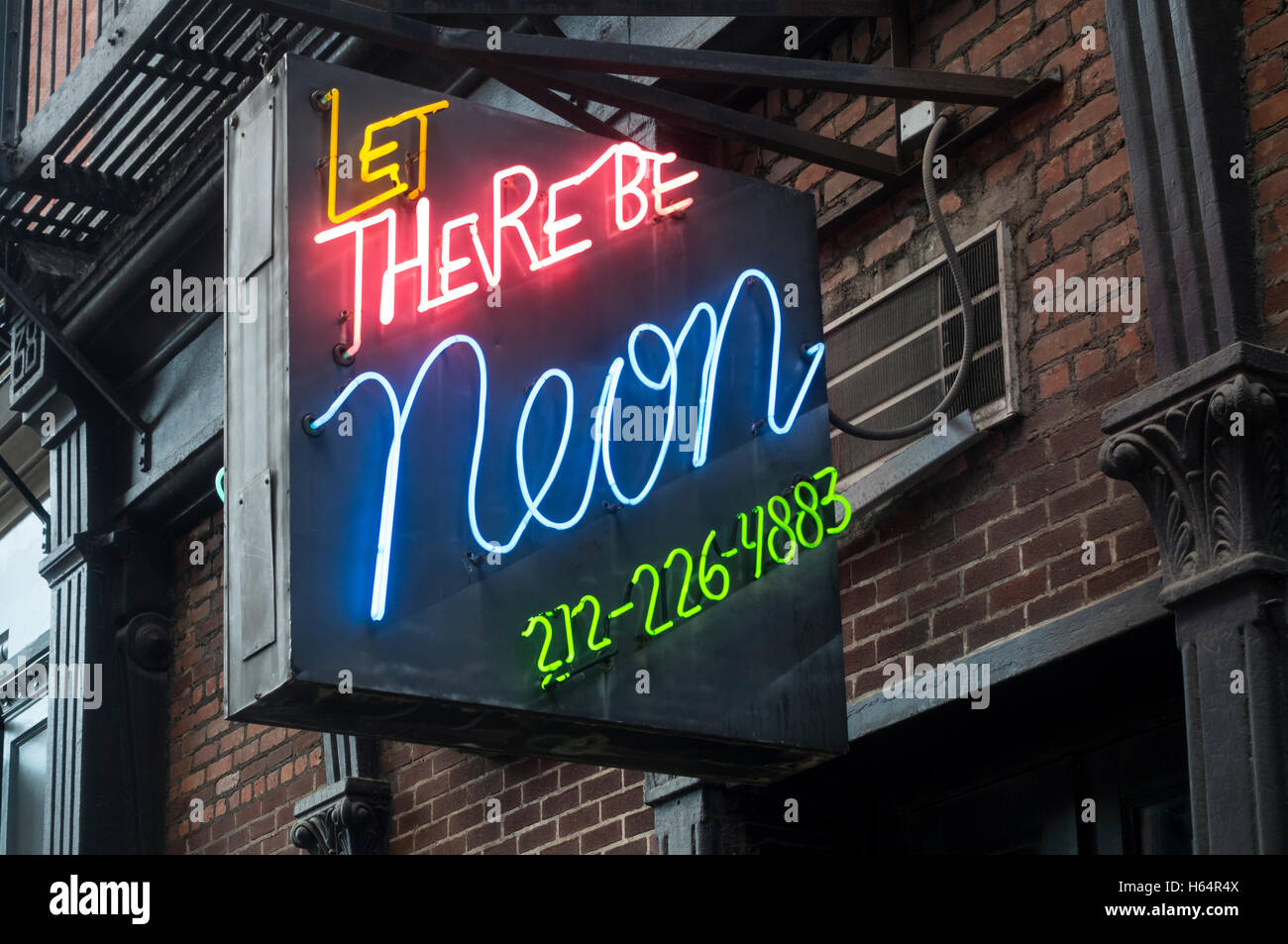 Let There Be Neon sign outside a retailer in Tribeca in New York City ...
