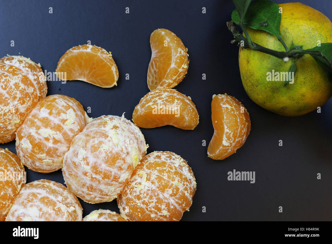 mandarin fruit isolate black Stock Photo - Alamy