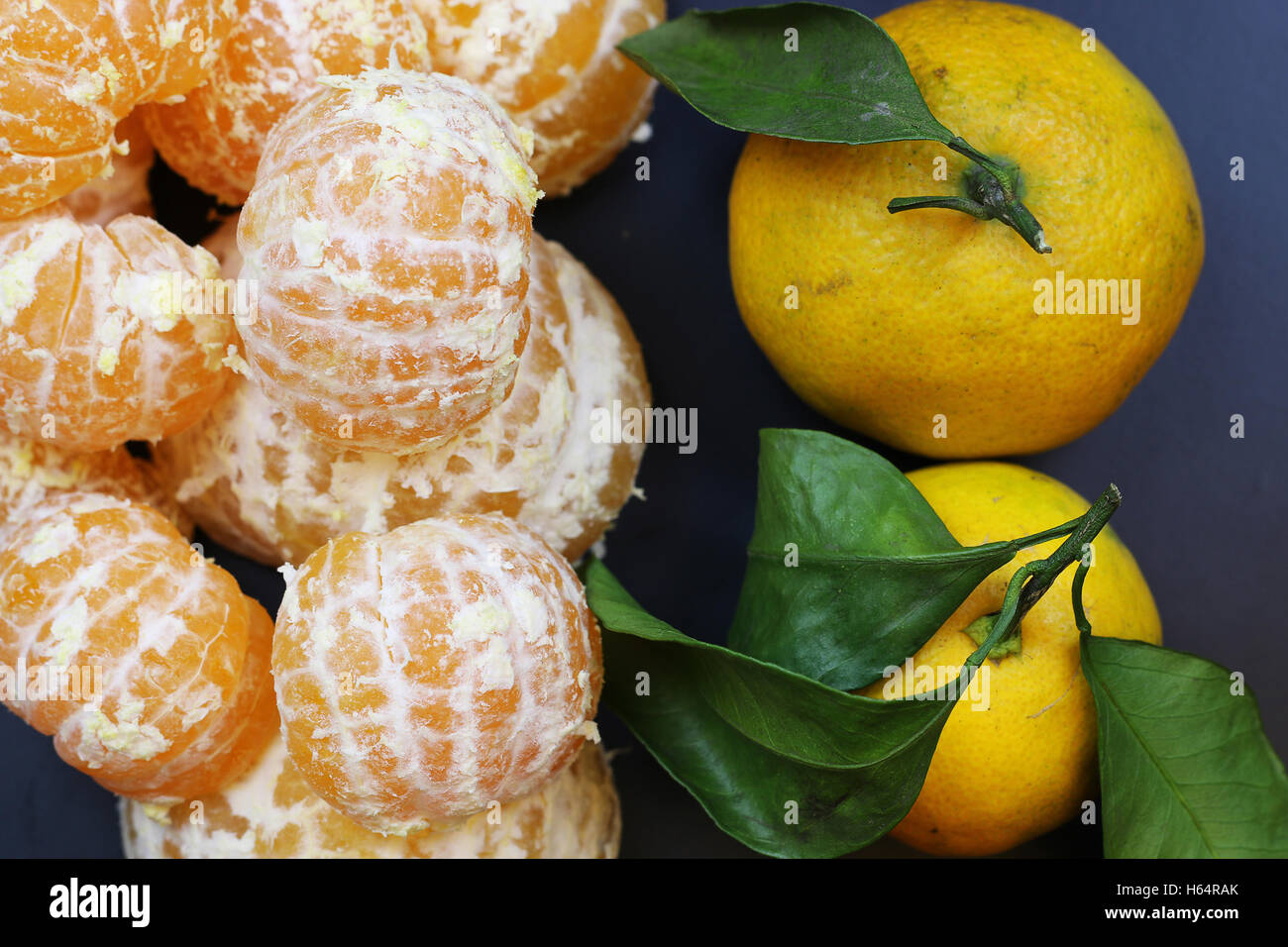 mandarin fruit isolate black Stock Photo - Alamy
