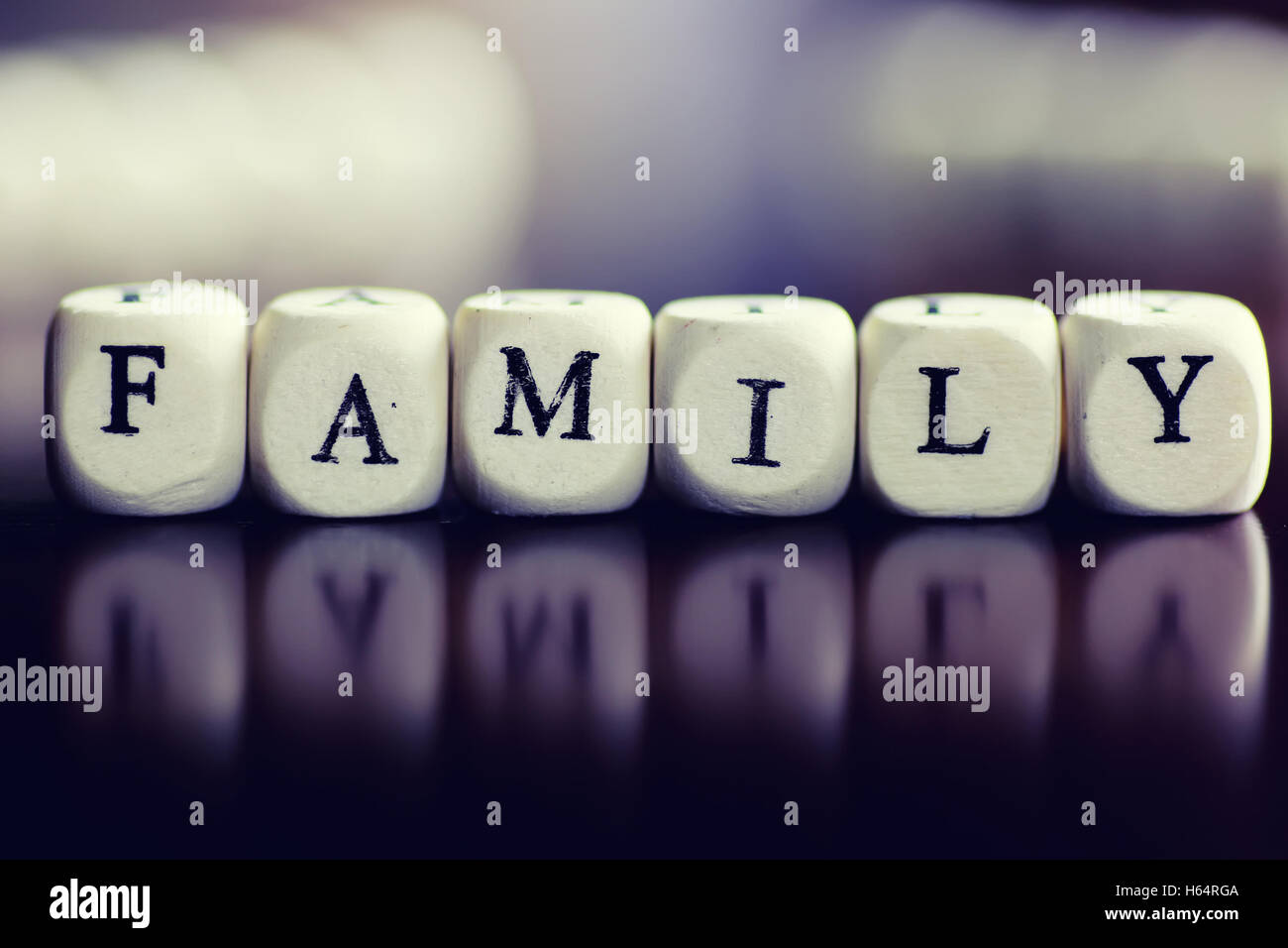 wood text cube family Stock Photo - Alamy