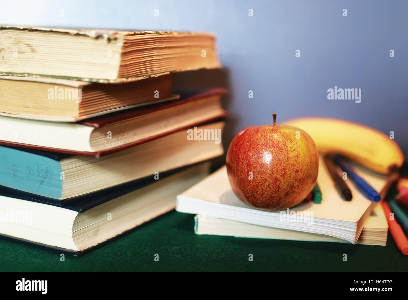 education concept books stack, apple and pen Stock Photo - Alamy