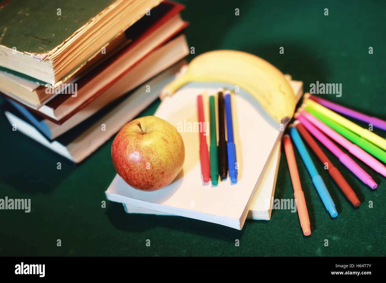 education concept books stack, apple and pen Stock Photo - Alamy