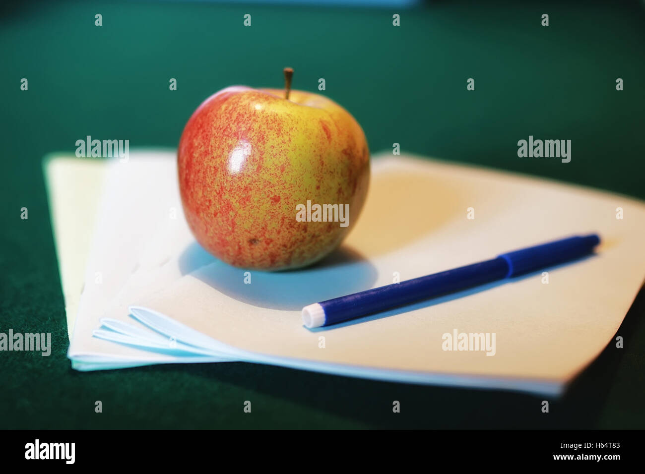 education concept books stack, apple and pen Stock Photo - Alamy
