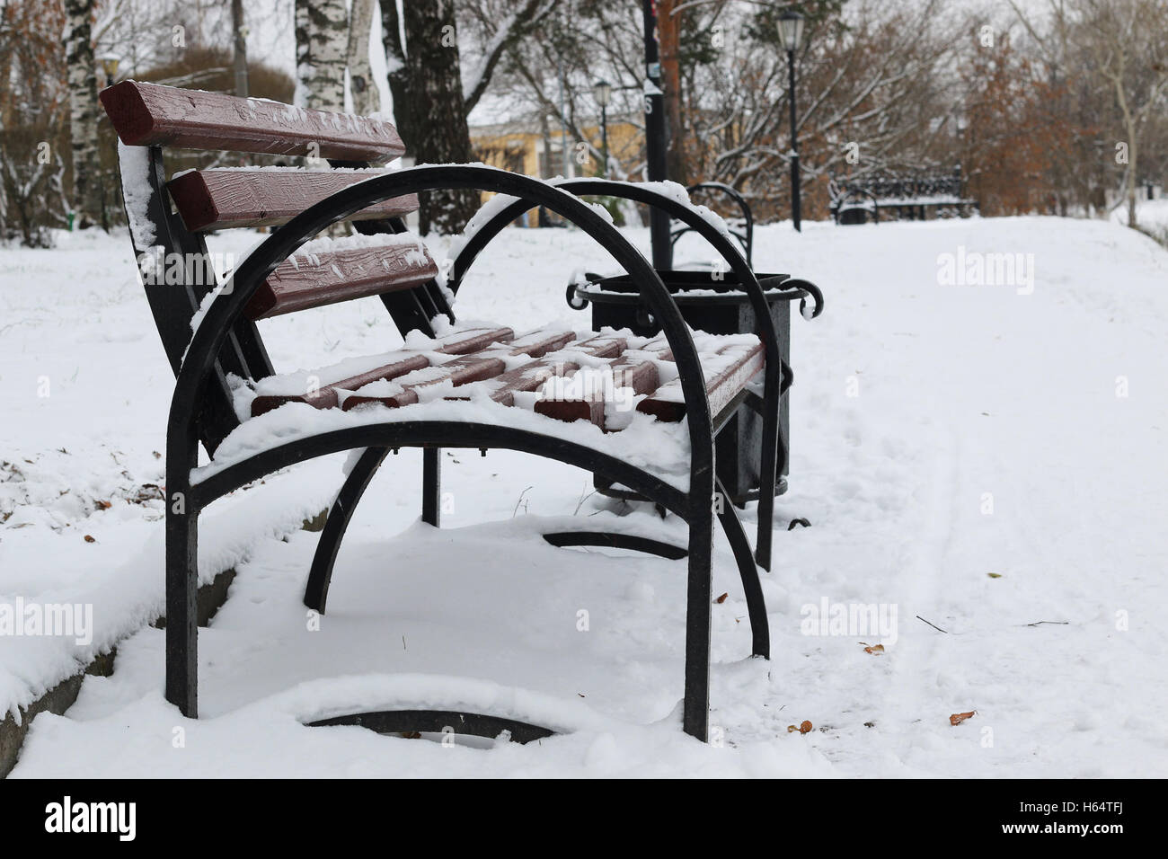Winter bench in a park Stock Photo - Alamy