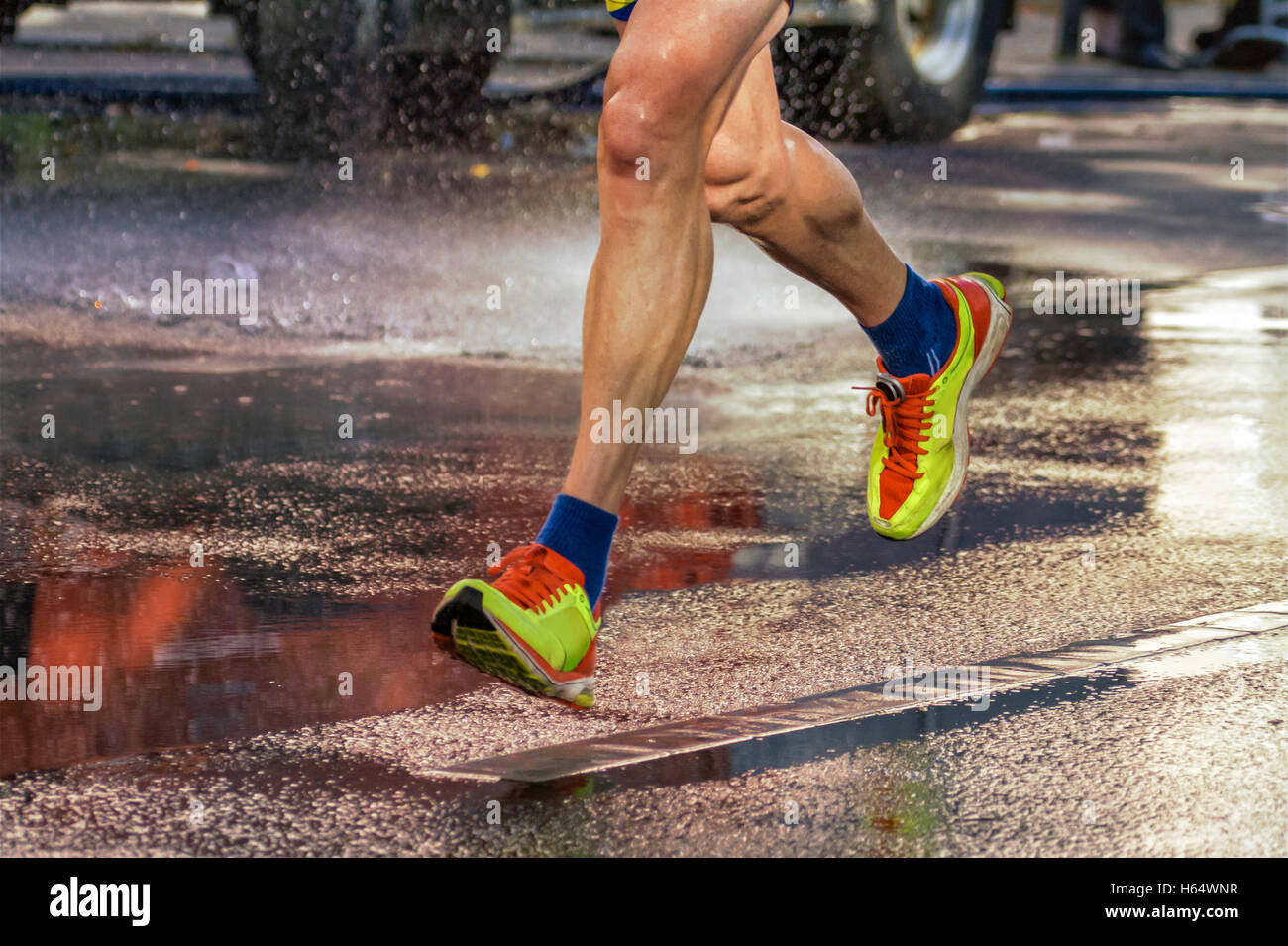 Street runner runs along a rainy sunlit street Stock Photo - Alamy
