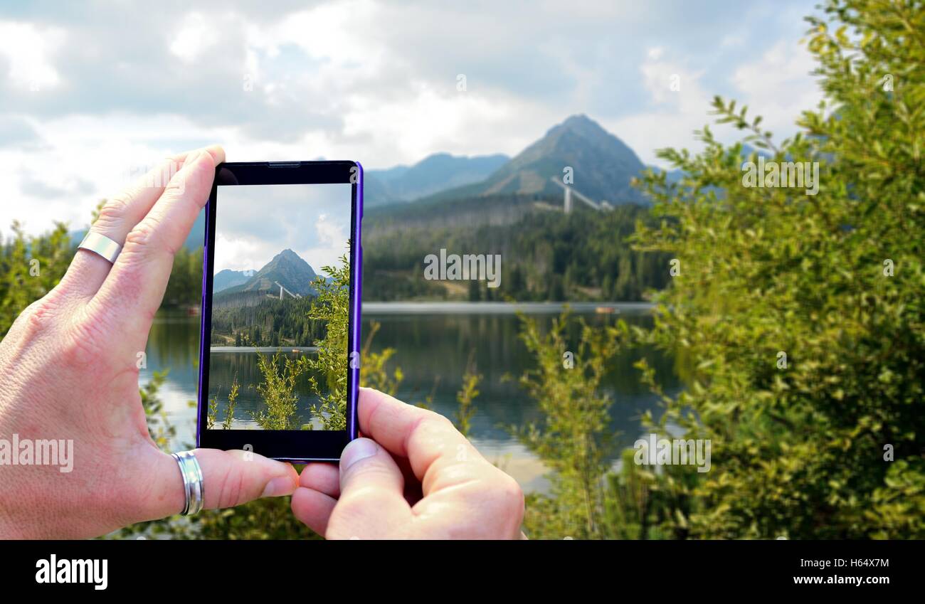 View over the mobile phone display during taking a picture of landscape ...