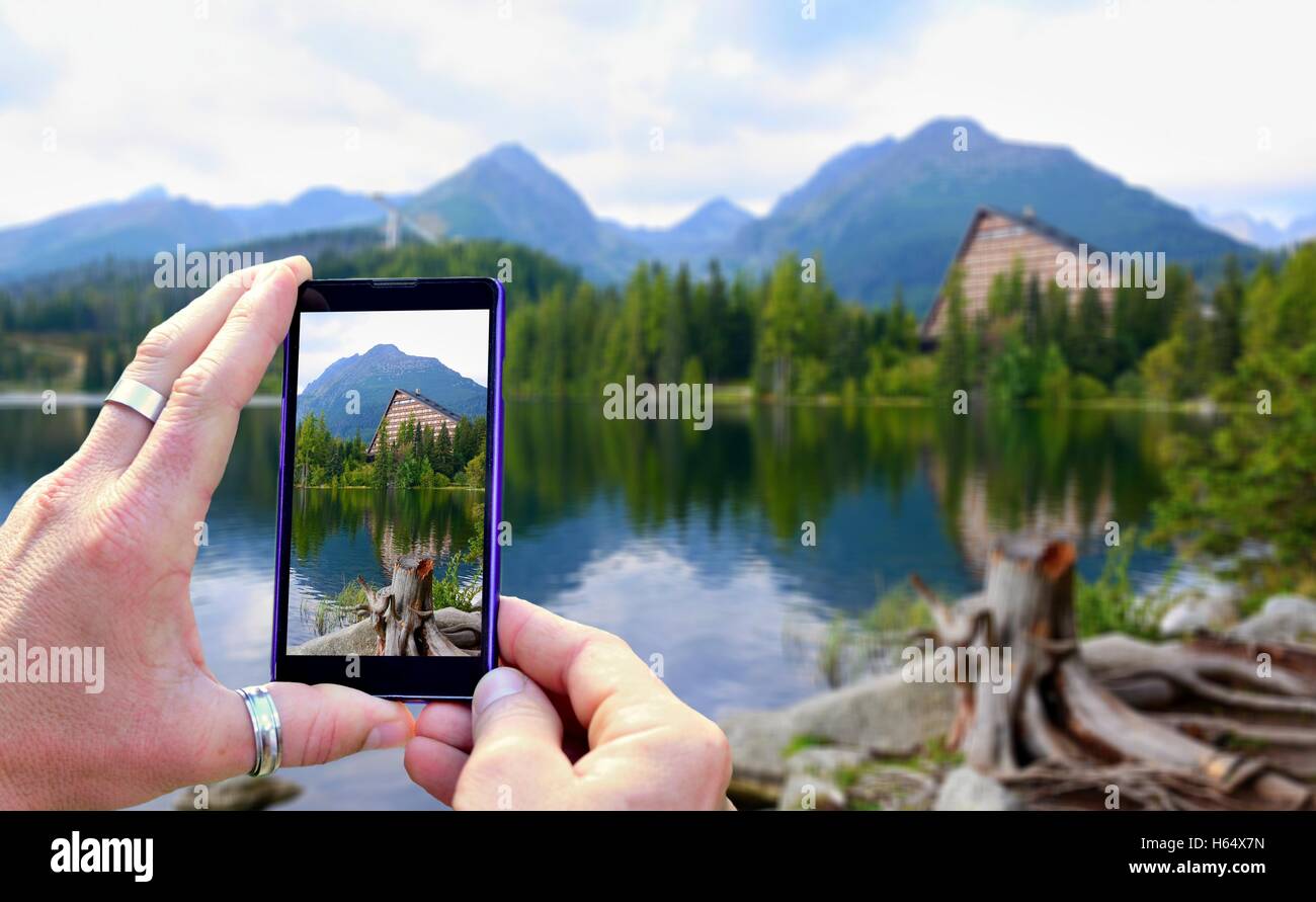 View over the mobile phone display during taking a picture of landscape ...