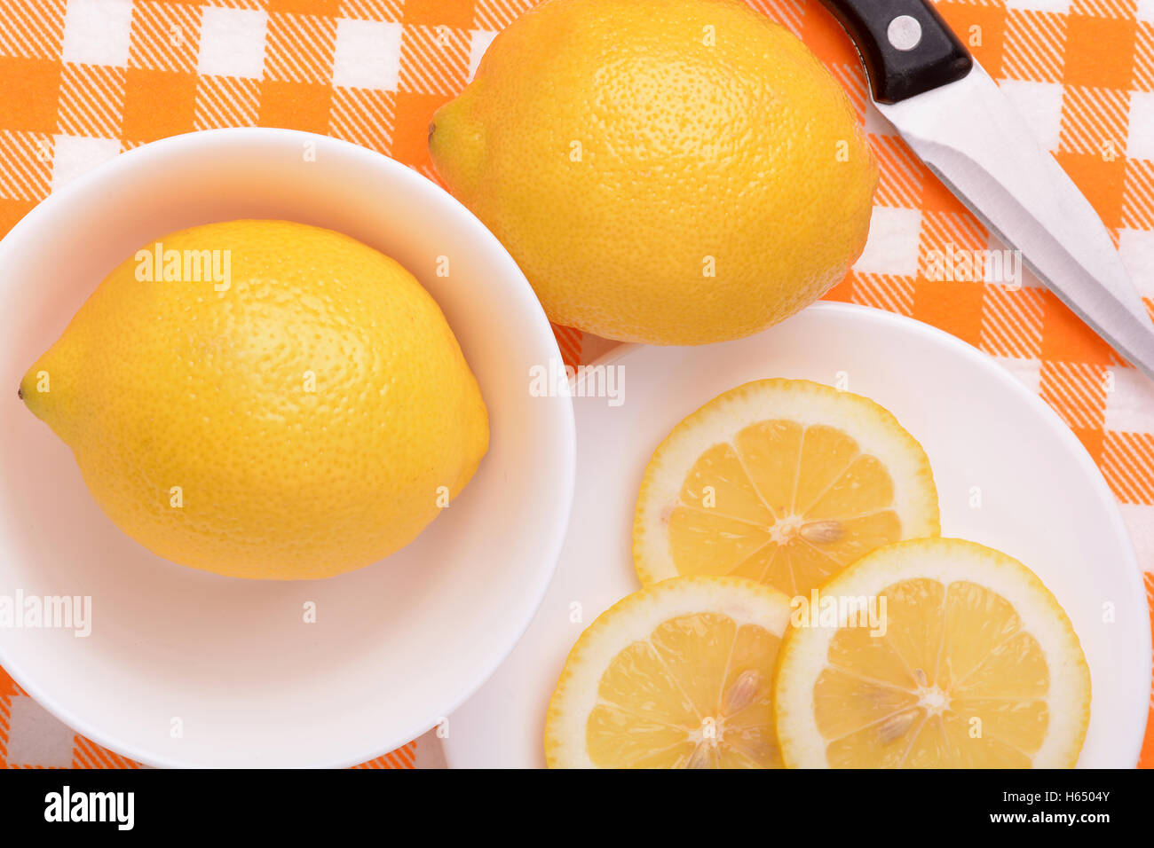 A slices of fresh yellow lemon. Lemon pieces in different sizes ...