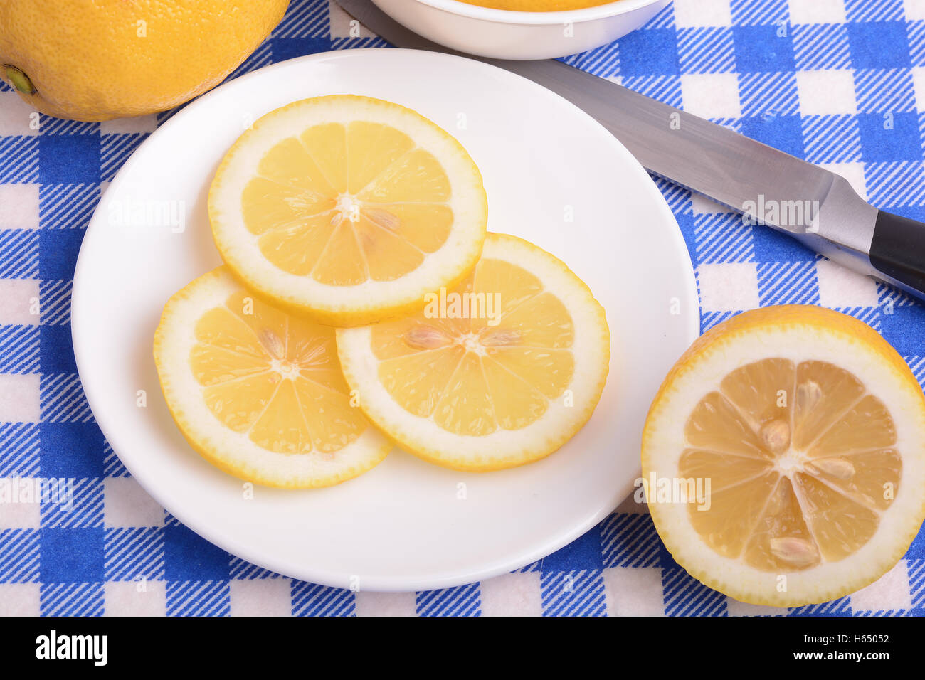 A slices of fresh yellow lemon. Lemon pieces in different sizes ...