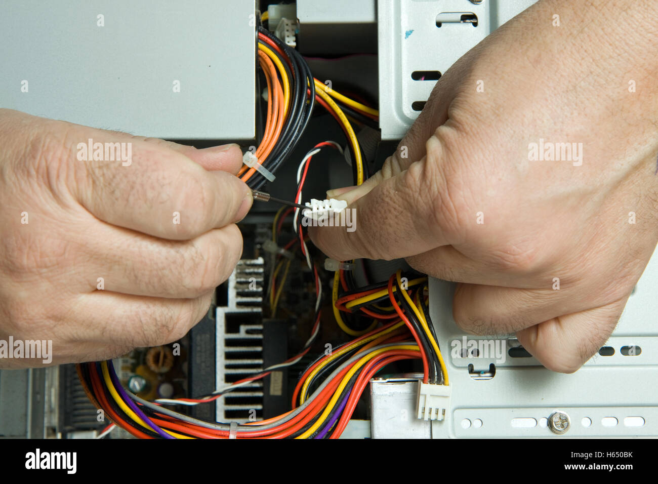 electrician at work with an electric device Stock Photo - Alamy