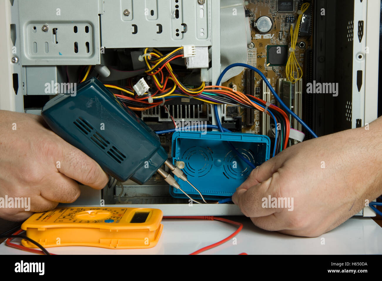 electrician at work with an electric device Stock Photo - Alamy