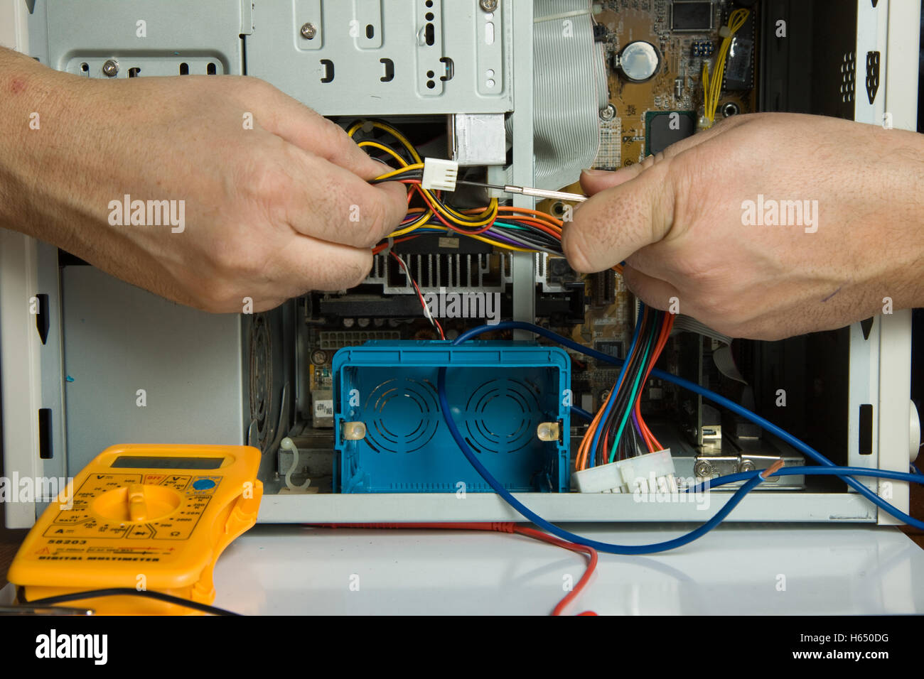 electrician at work with an electric device Stock Photo - Alamy