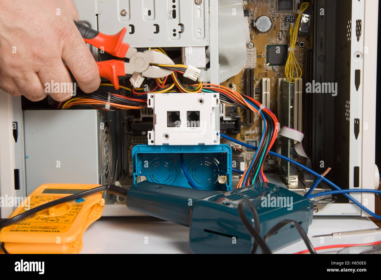 electrician at work with an electric device Stock Photo - Alamy