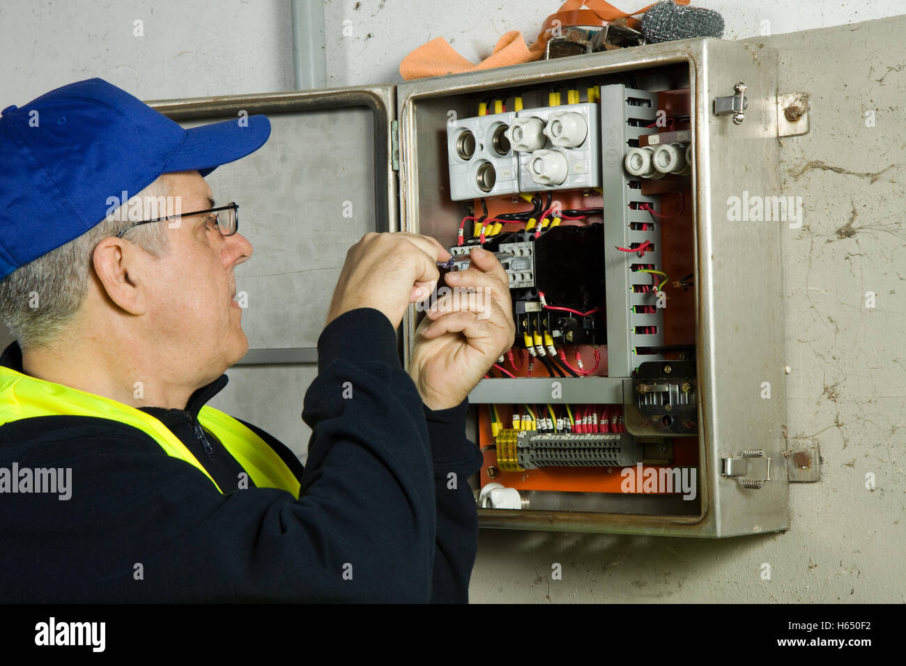 electrician at work with an electric plant Stock Photo - Alamy