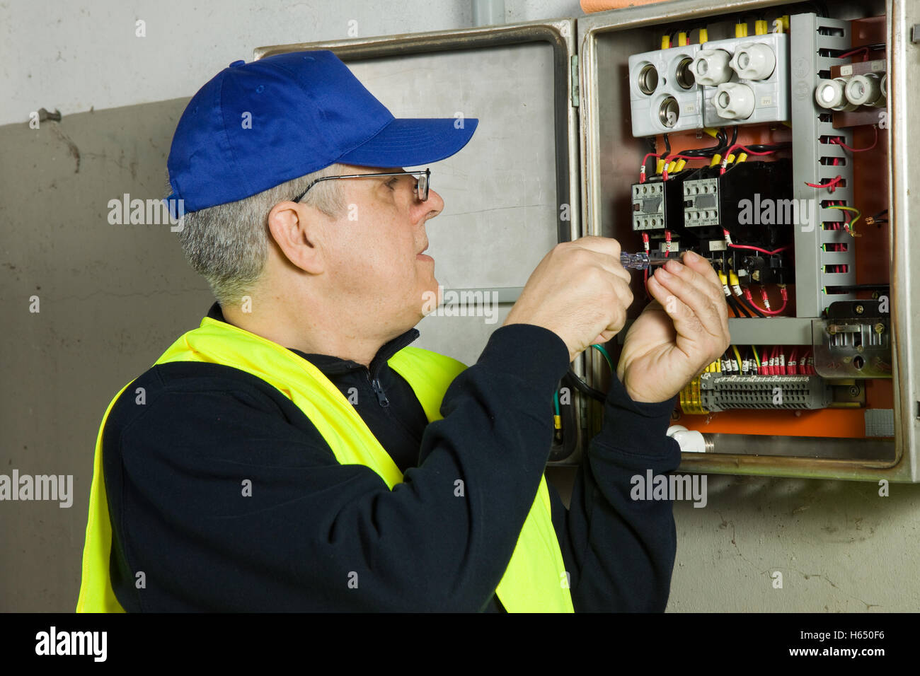 electrician at work with an electric plant Stock Photo - Alamy
